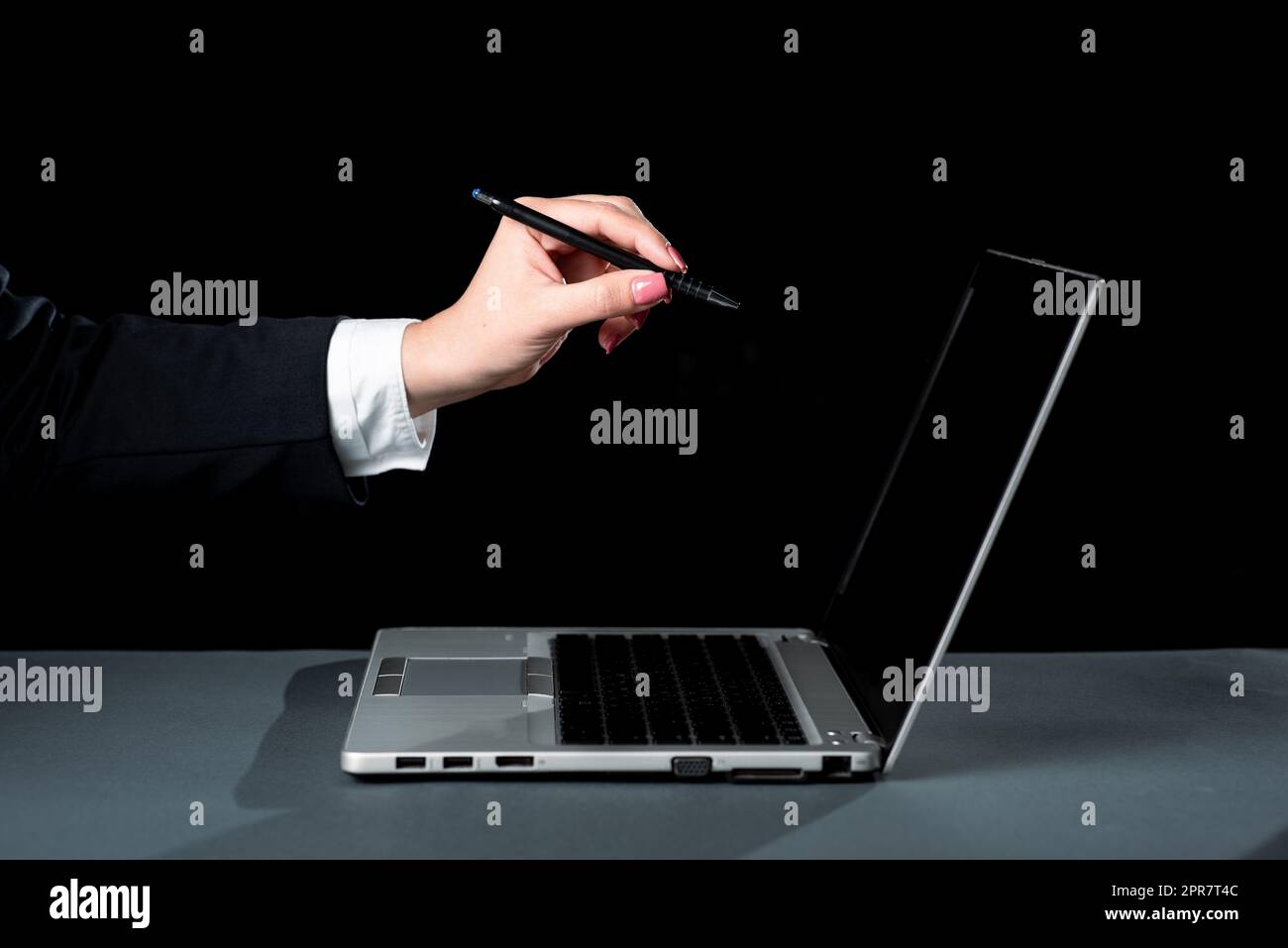 Professional young lady pointing laptop hi-res stock photography and ...
