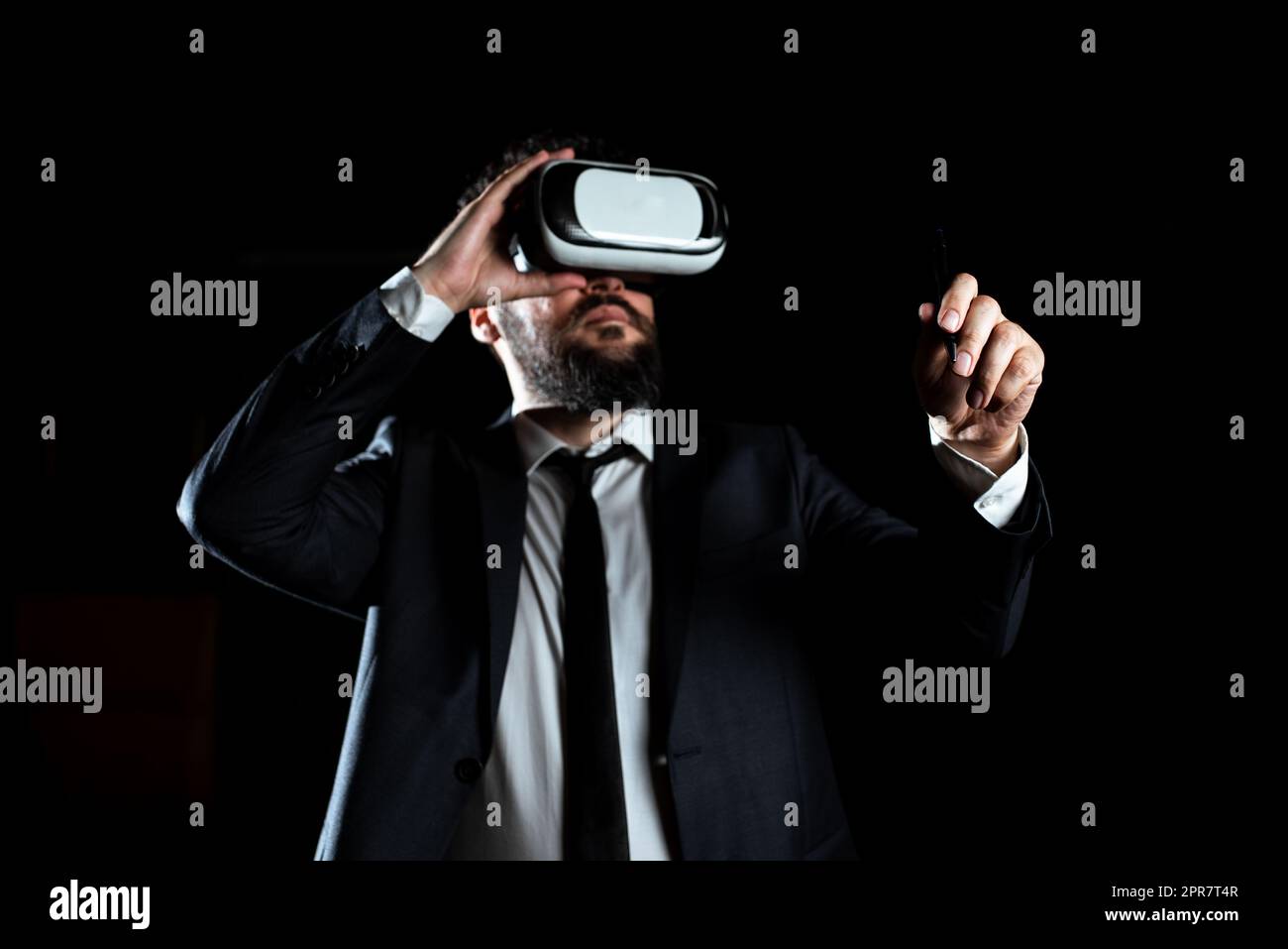Male Professional Wearing Virtual Reality Goggles Holding Pen And ...