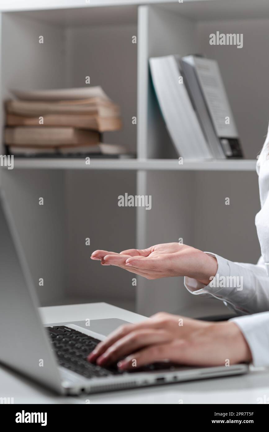 Businesswoman Typing Recent Update On Lap Top Keyboard On Desk And ...
