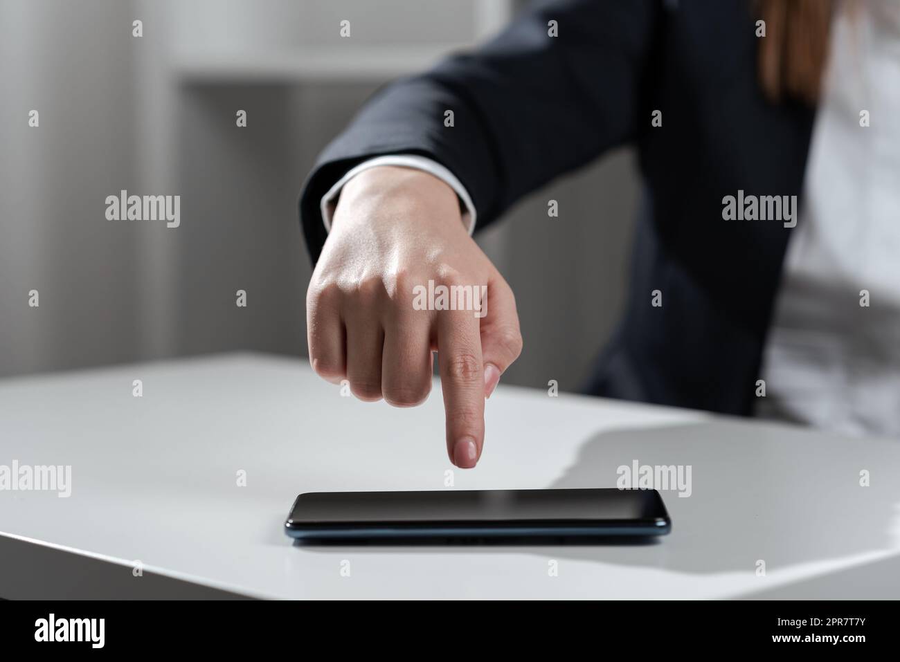 Businesswoman Pointing Important Infortmation With One Finger On Phone ...