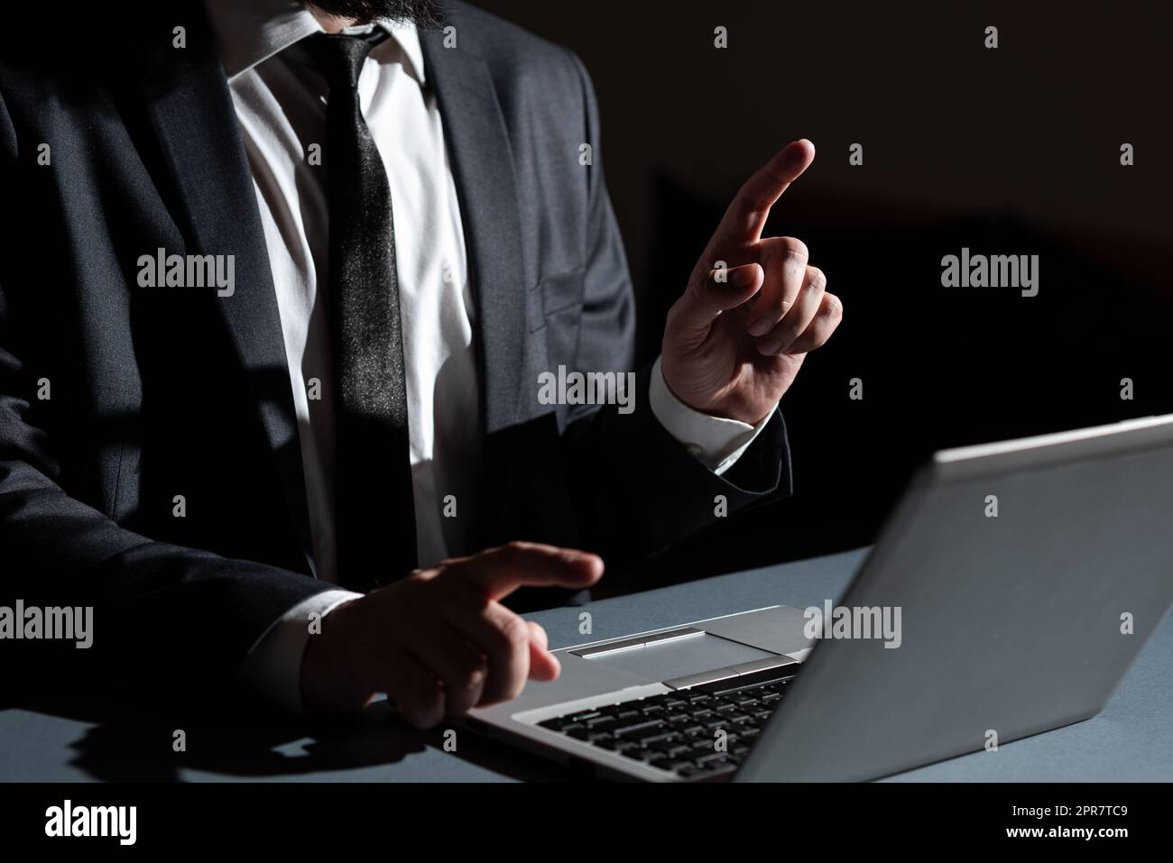 Businessman Pointing With Two Fingers On Important Information Sitting ...