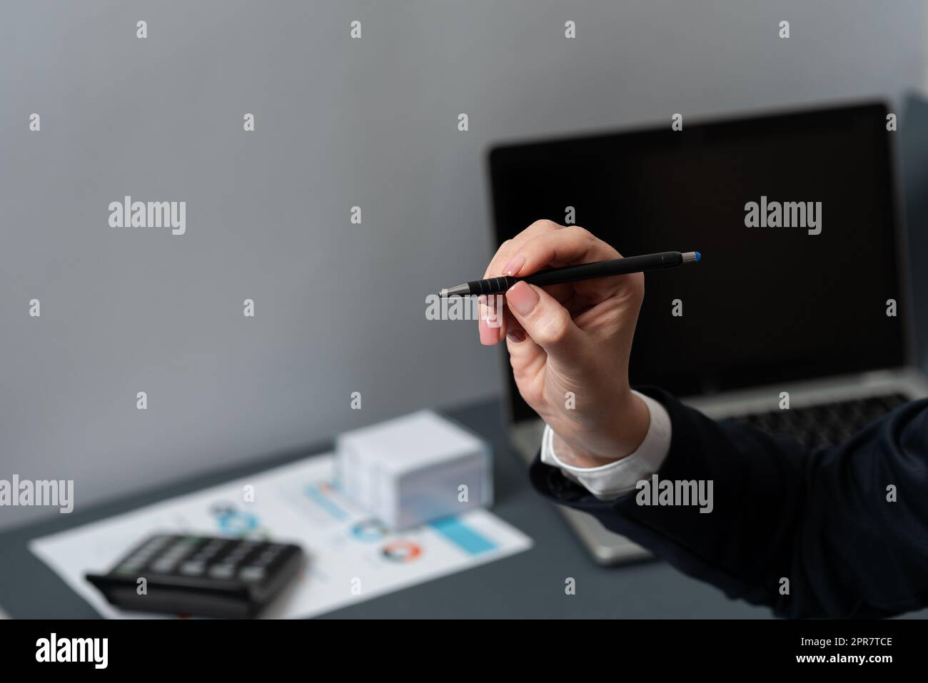 Hand pointing calculator pencil hi-res stock photography and images - Alamy