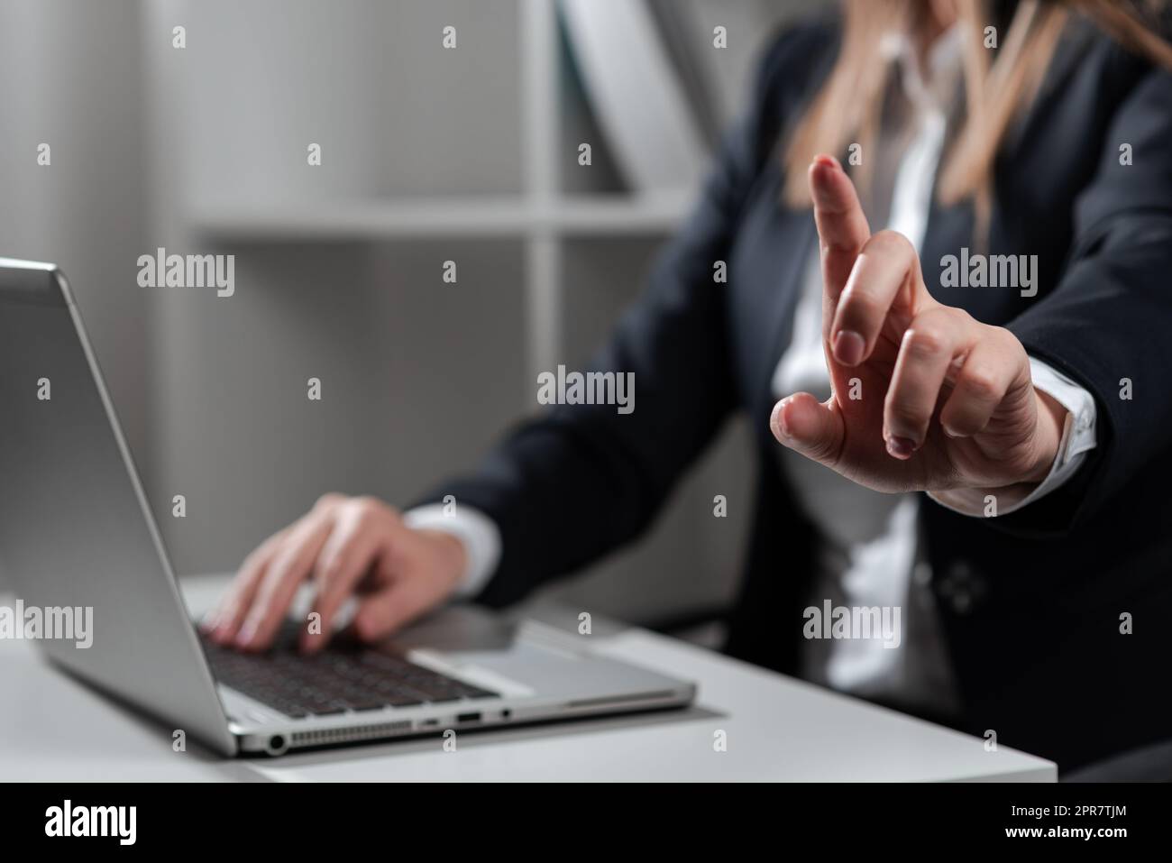 Businesswoman Typing Recent Updates On Lap Top Keyboard On Desk With ...