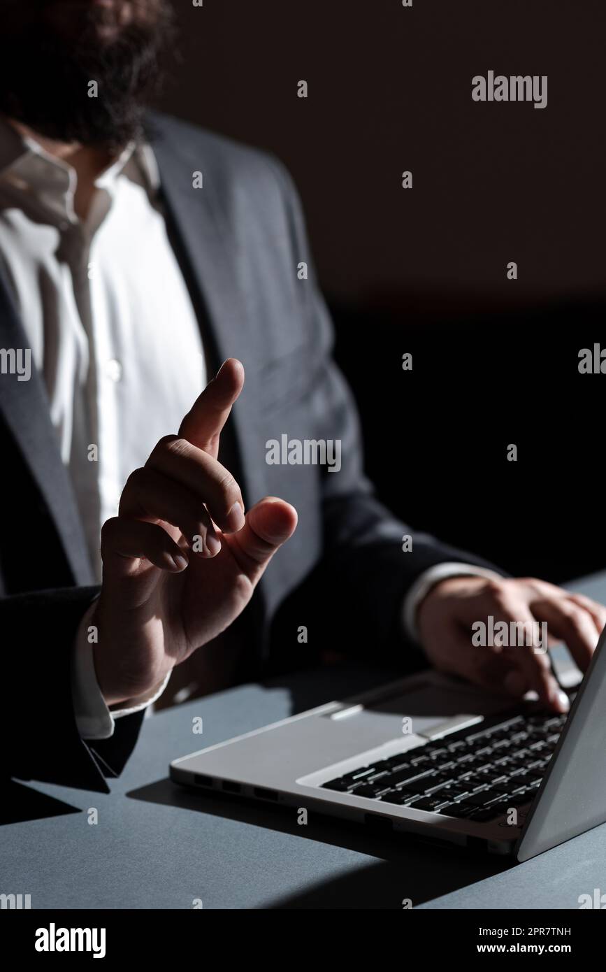 Businessman Typing Important Informations Into Lap Top And Pointing New ...