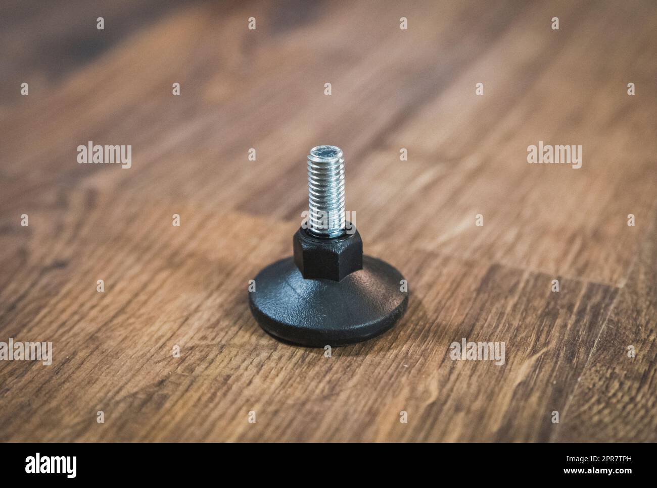 plastic stand with metal bolt which will attached to the furniture ...