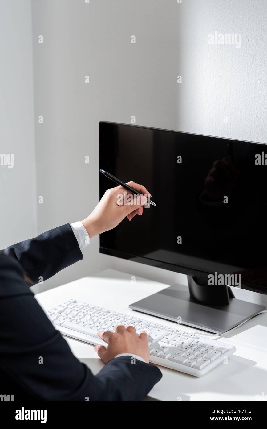 Businesswoman Typing Recent Updates On Lap Top Keyboard On Desk And ...