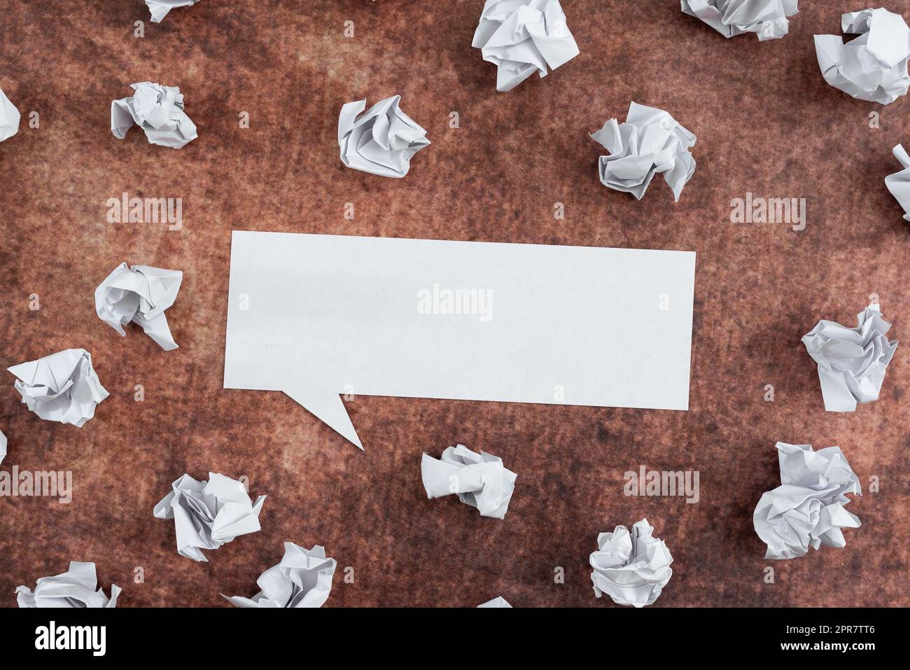 Speech Bubble Made Of Sheet Surrounded With Crumpled Papers Over Wooden ...