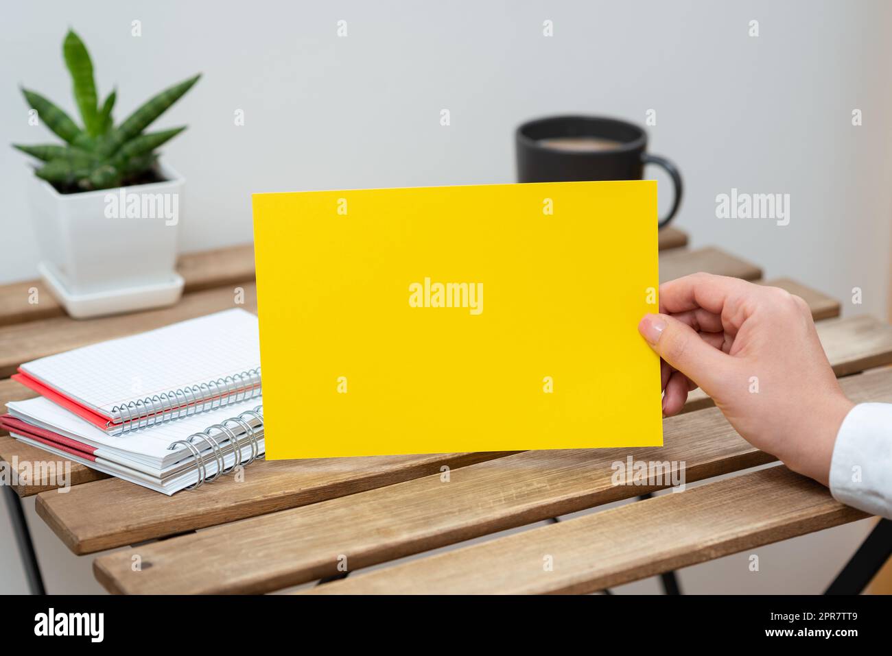 Woman Holding Important Message On Paper On Table With Coffee ...
