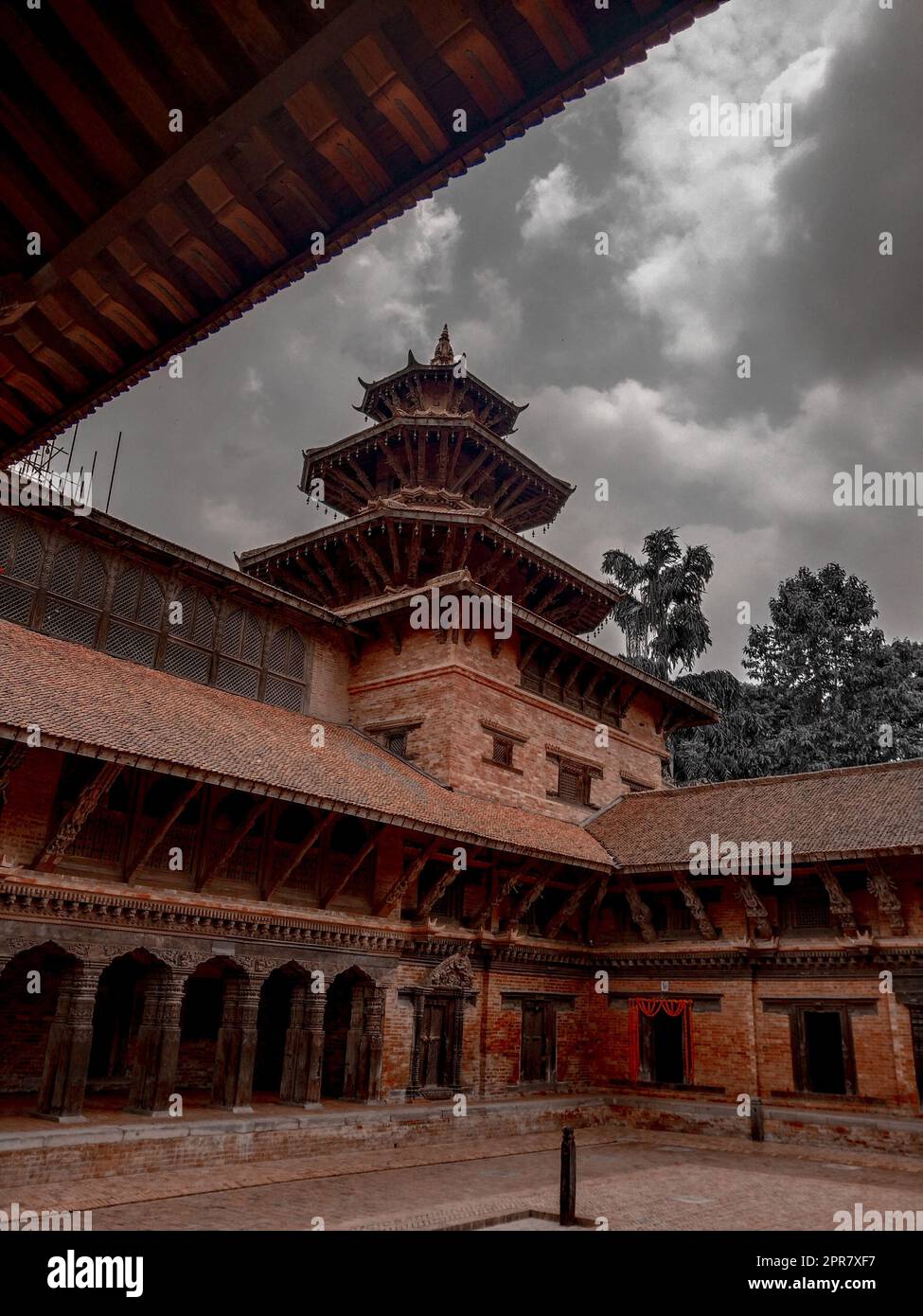 A vertical shot of the historic Krishna Temple on a gloomy day in ...