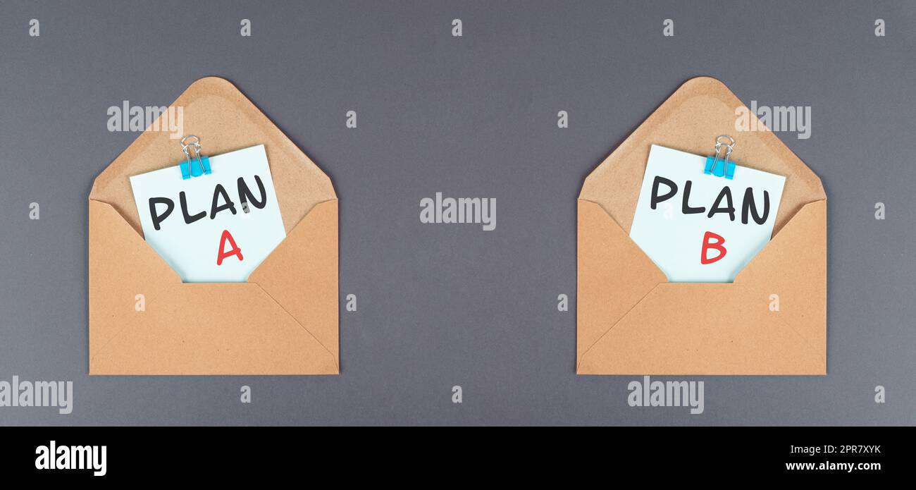 Plan A and B standing on paper, brainstorming for possibilities, making ...