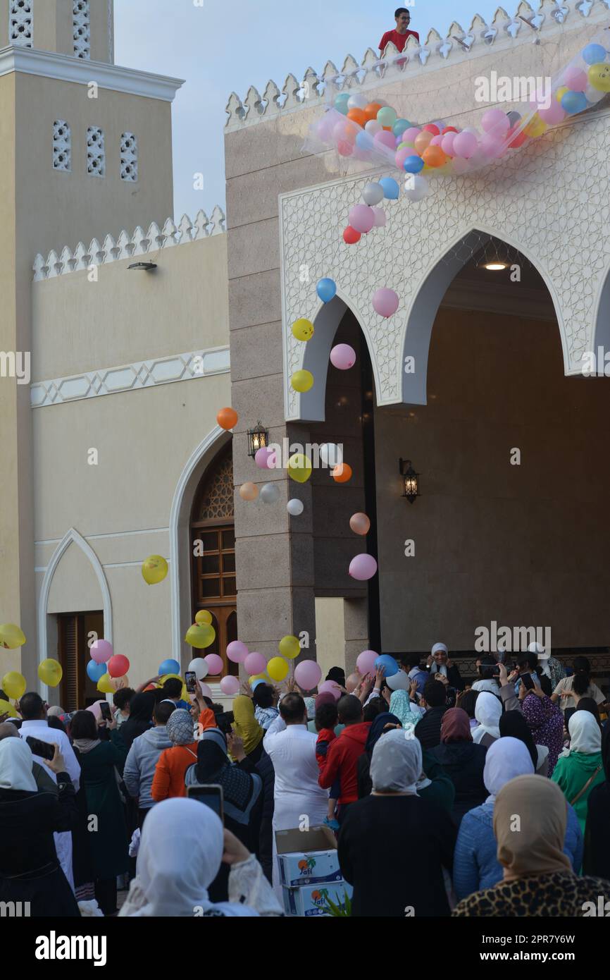 Cairo, Egypt, April 21 2023: Throwing balloons for kids and children ...