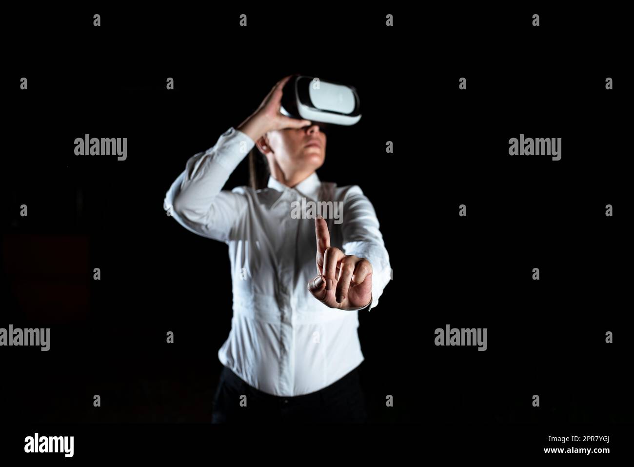 Female Professional Wearing Virtual Reality Headset Gesturing And ...