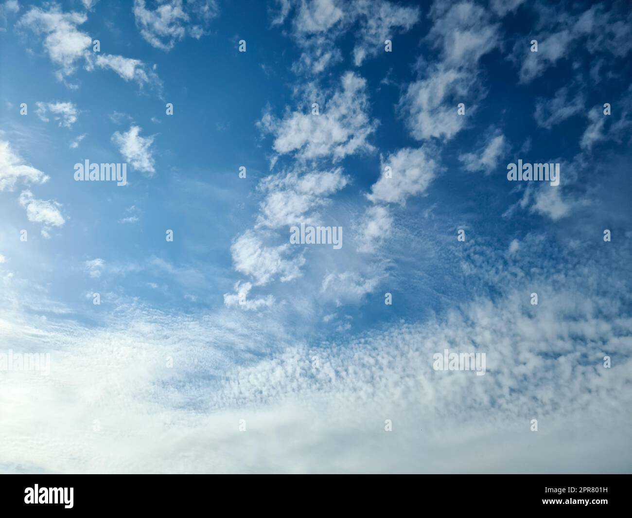 Beautiful fluffy white cloud formations in a deep blue summer sky Stock ...