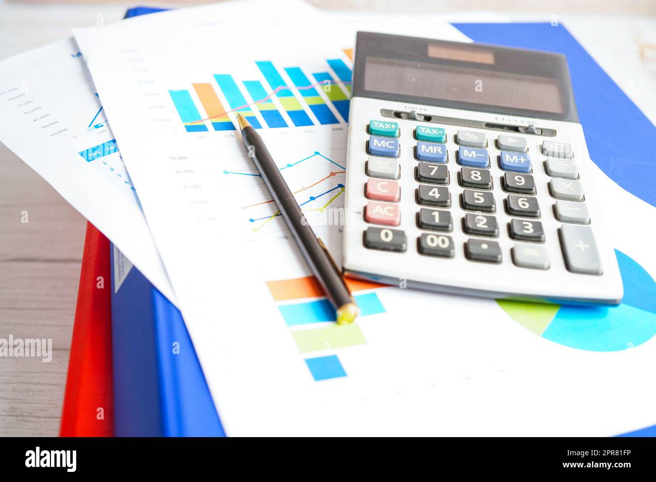 Calculator on chart and graph spreadsheet paper. Finance development ...