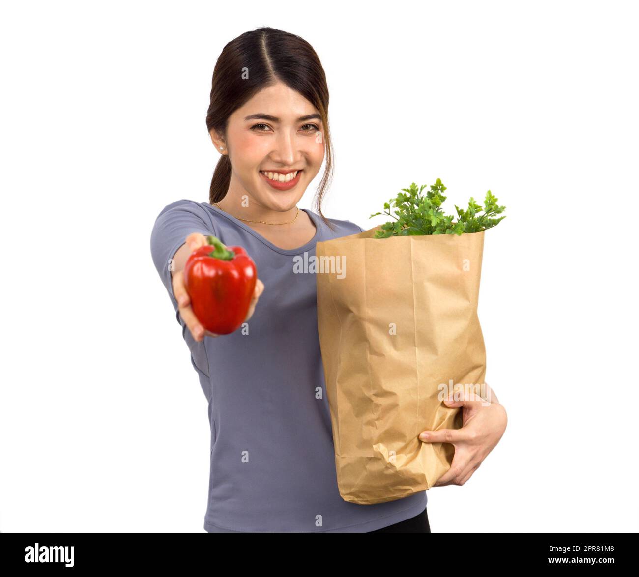 Beautiful woman holding pepper in hi-res stock photography and images ...