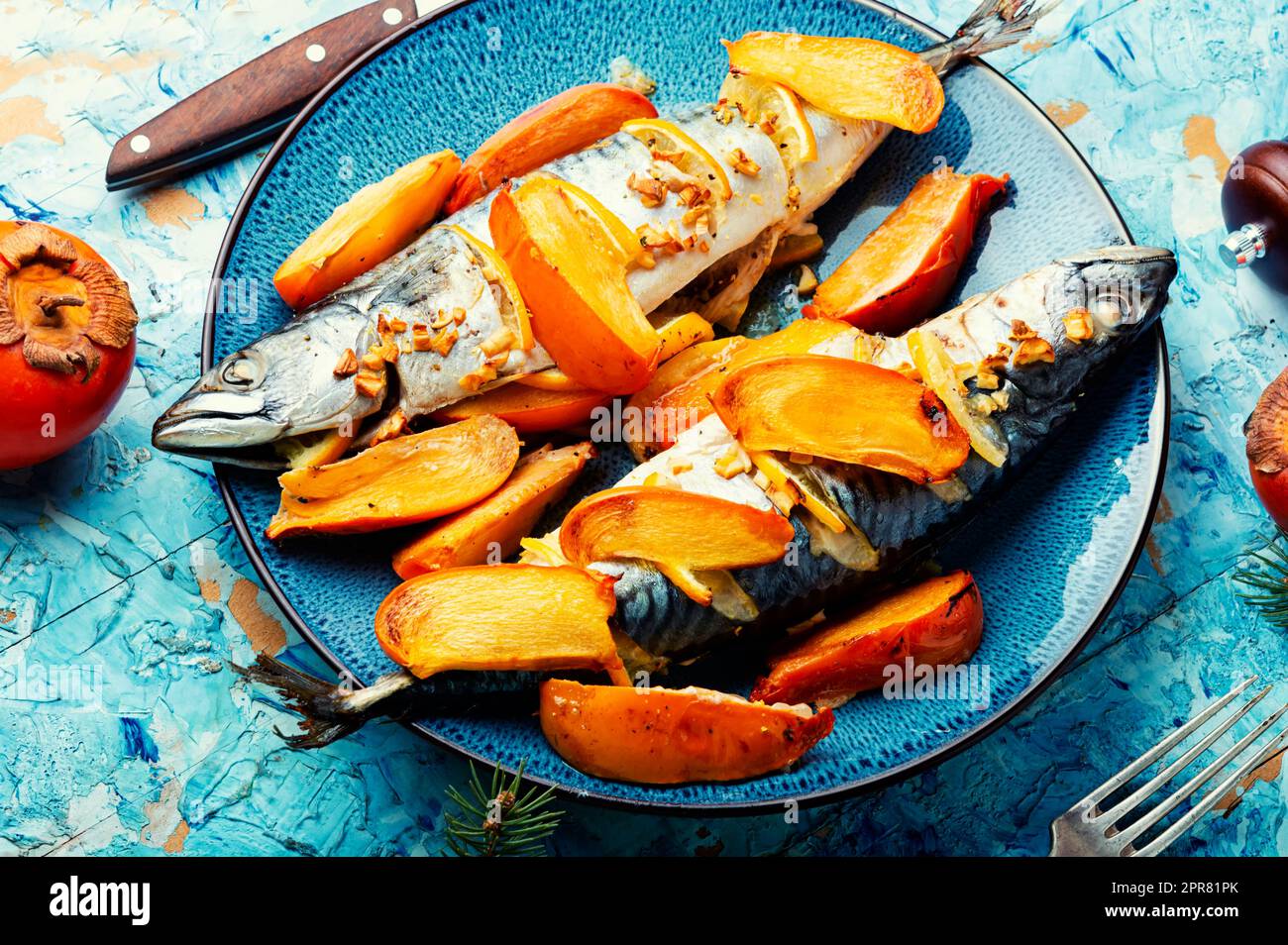 Baked fish with persimmon Stock Photo - Alamy