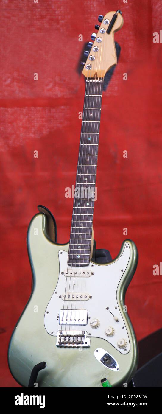 On a stage there is a guitar in a guitar stand ready for use Stock ...