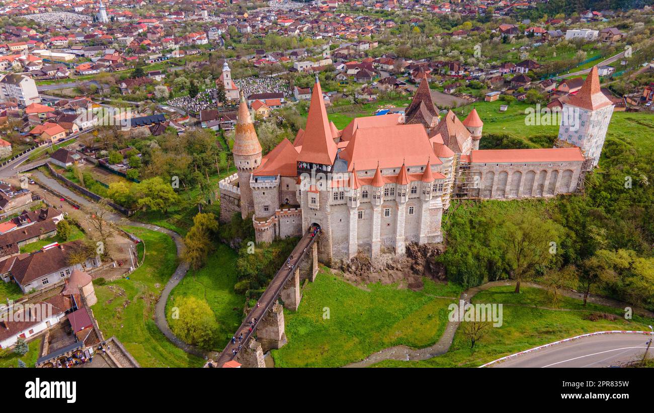 Aerial view of the Hunyad castle in Hunedoara, Romania in spring season ...