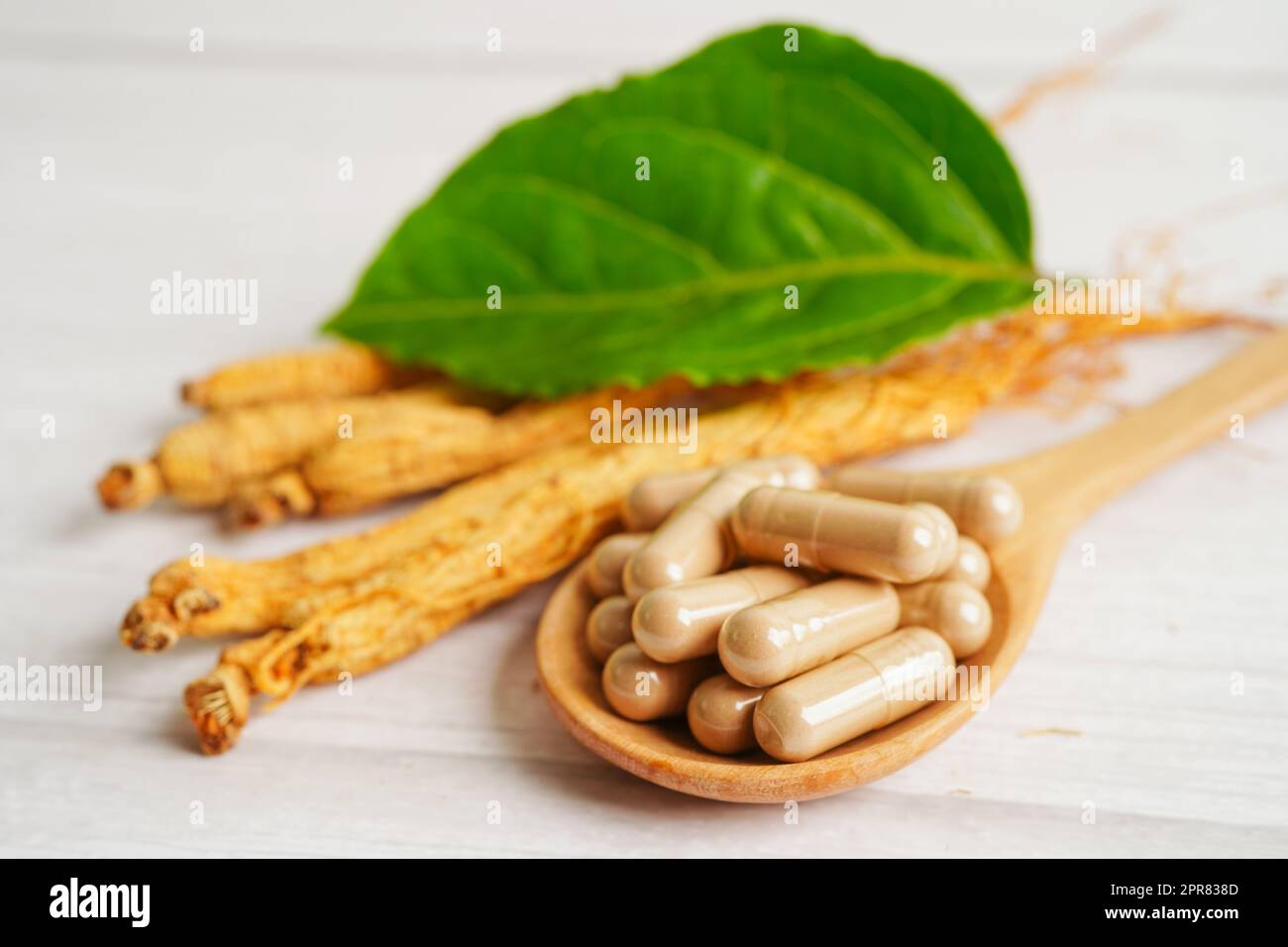Ginseng roots and green leaf, healthy food Stock Photo - Alamy