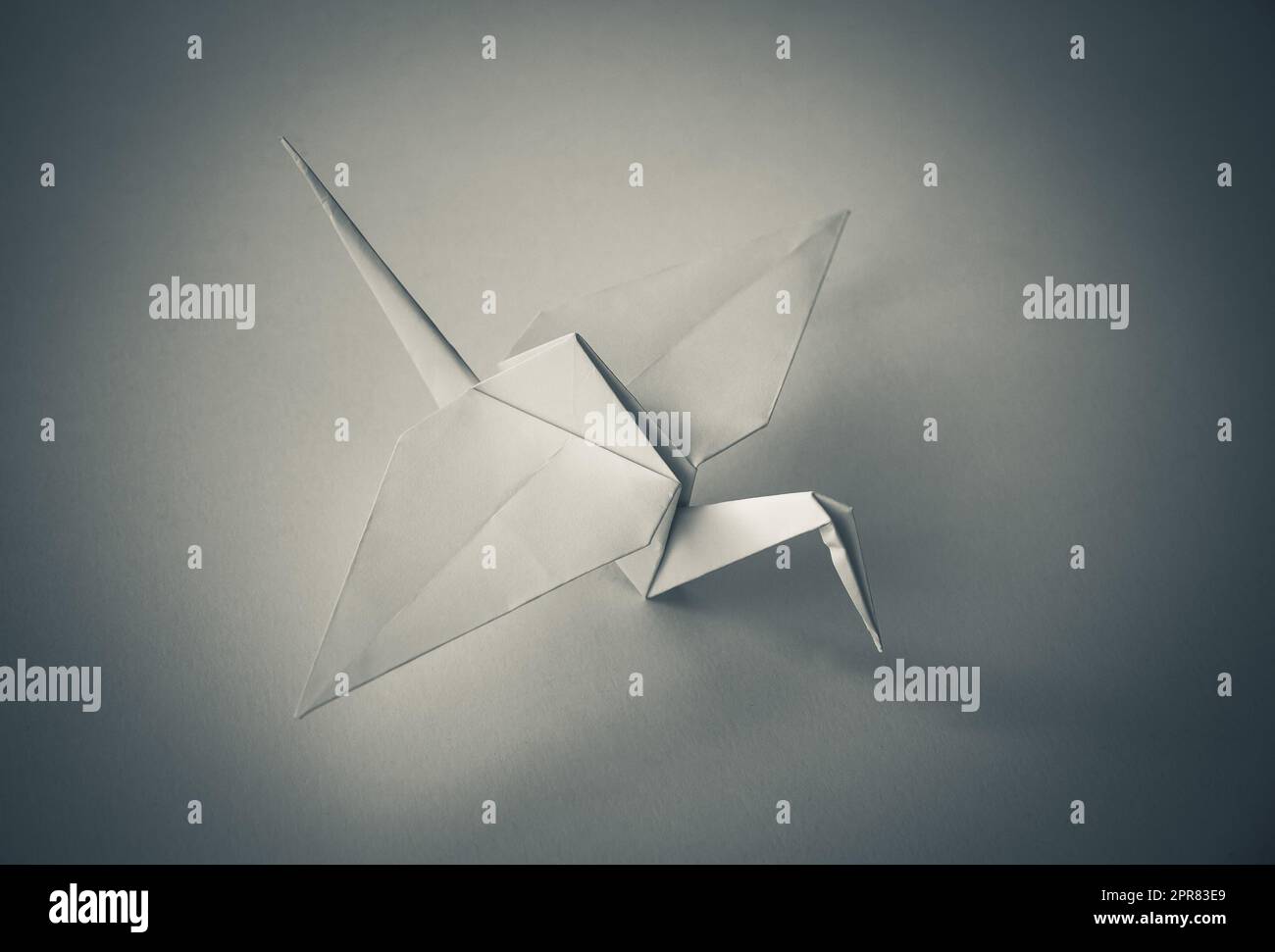 White paper crane origami isolated on blank background Stock Photo - Alamy