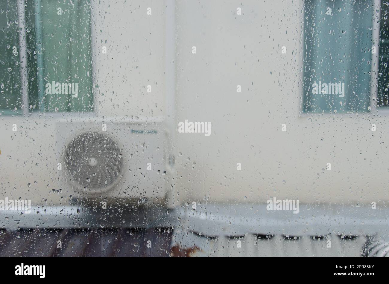 raindrops on the window of the house background Stock Photo - Alamy