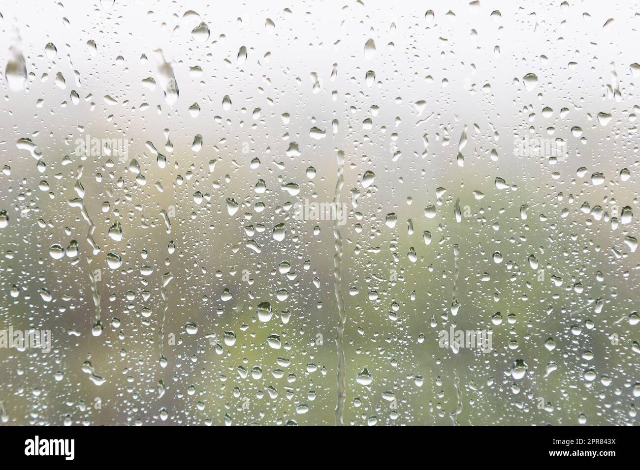 rain drops and trickles of rain on window glass Stock Photo - Alamy