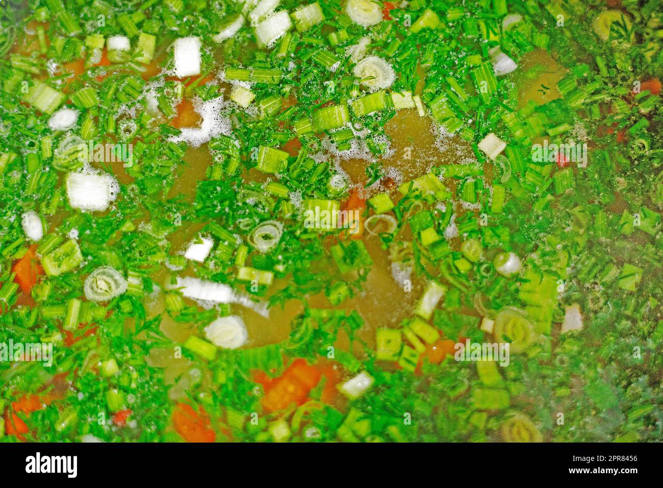abstract background of soup with herbs top view Stock Photo - Alamy