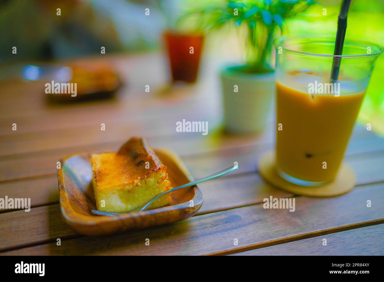 Cheesecake eating at the terrace seat Stock Photo - Alamy