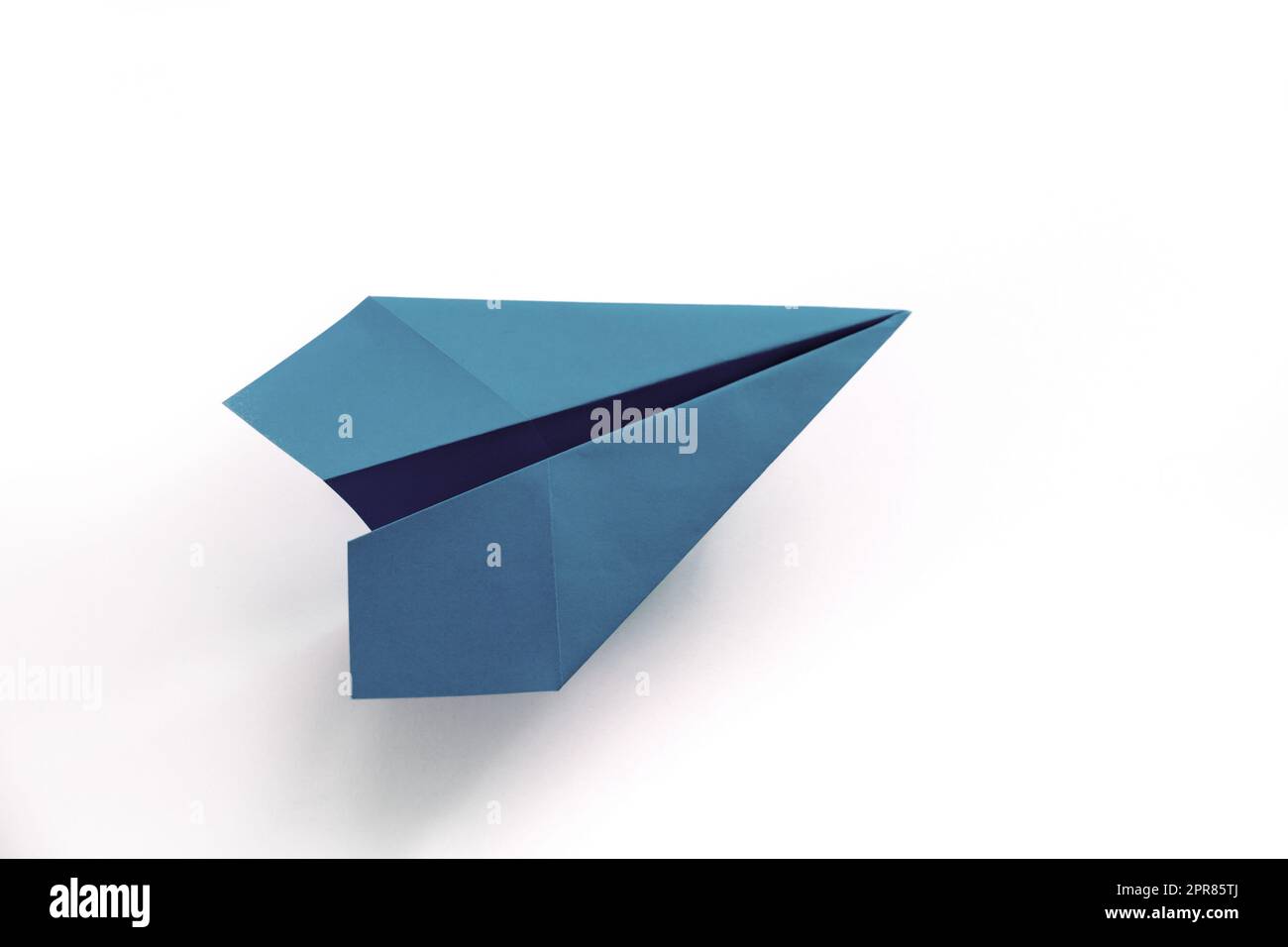 Blue paper plane origami isolated on a white background Stock Photo - Alamy
