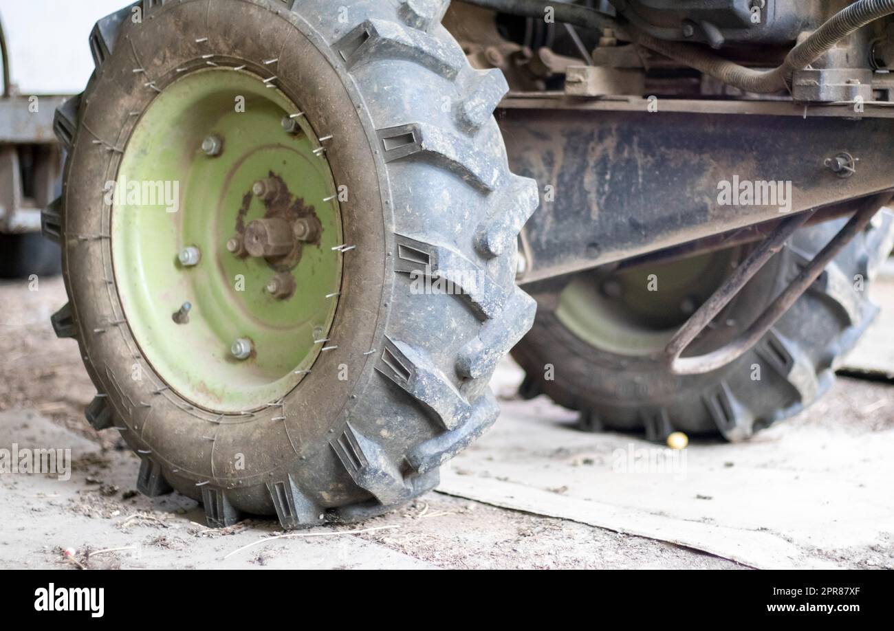 Typical heavy diesel walking tractor with trailer. Agricultural ...