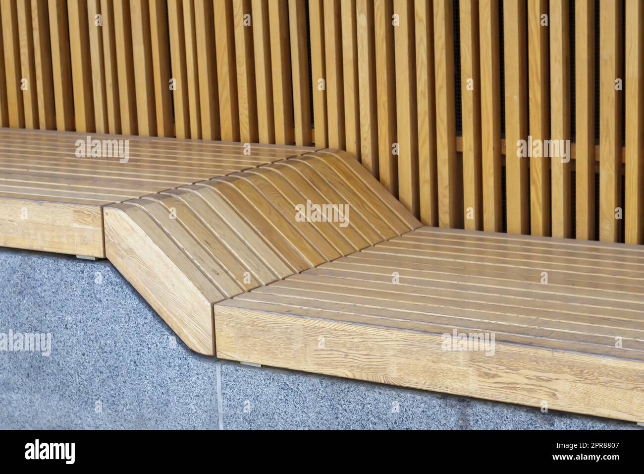 Empty modern wooden benches without people on a sunny day, public ...