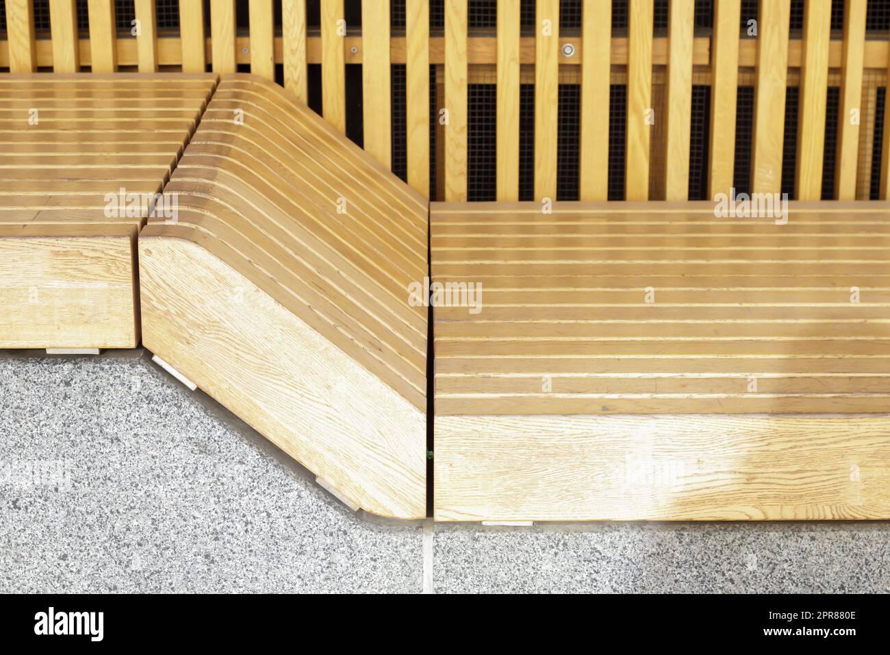 Empty modern wooden benches without people on a sunny day, public ...