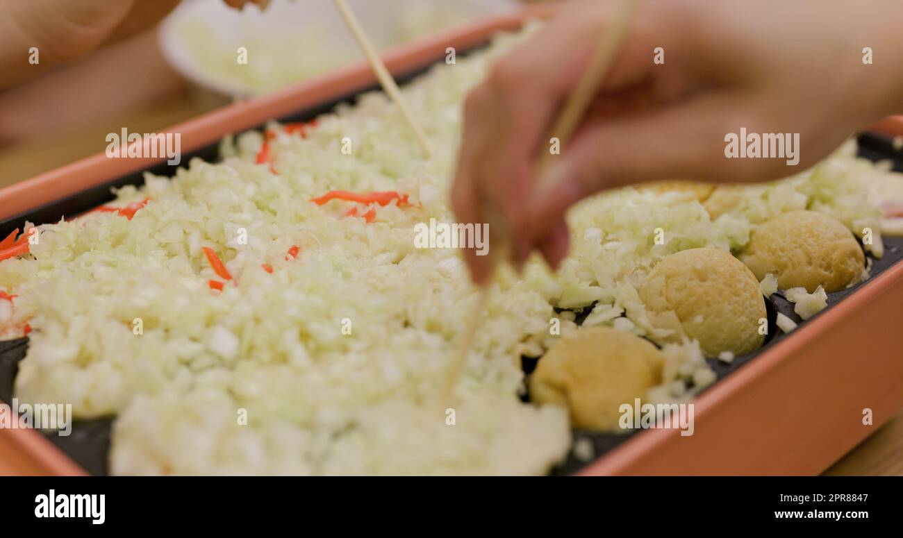 Making takoyaki, Octopus ball at home in the evening Stock Photo - Alamy