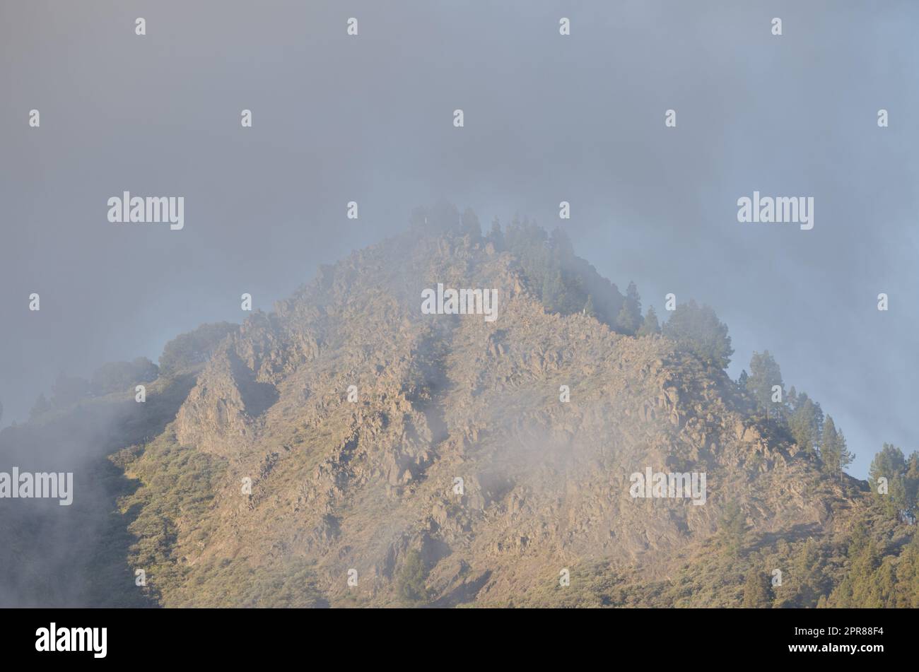 Cliff under the fog Stock Photo - Alamy