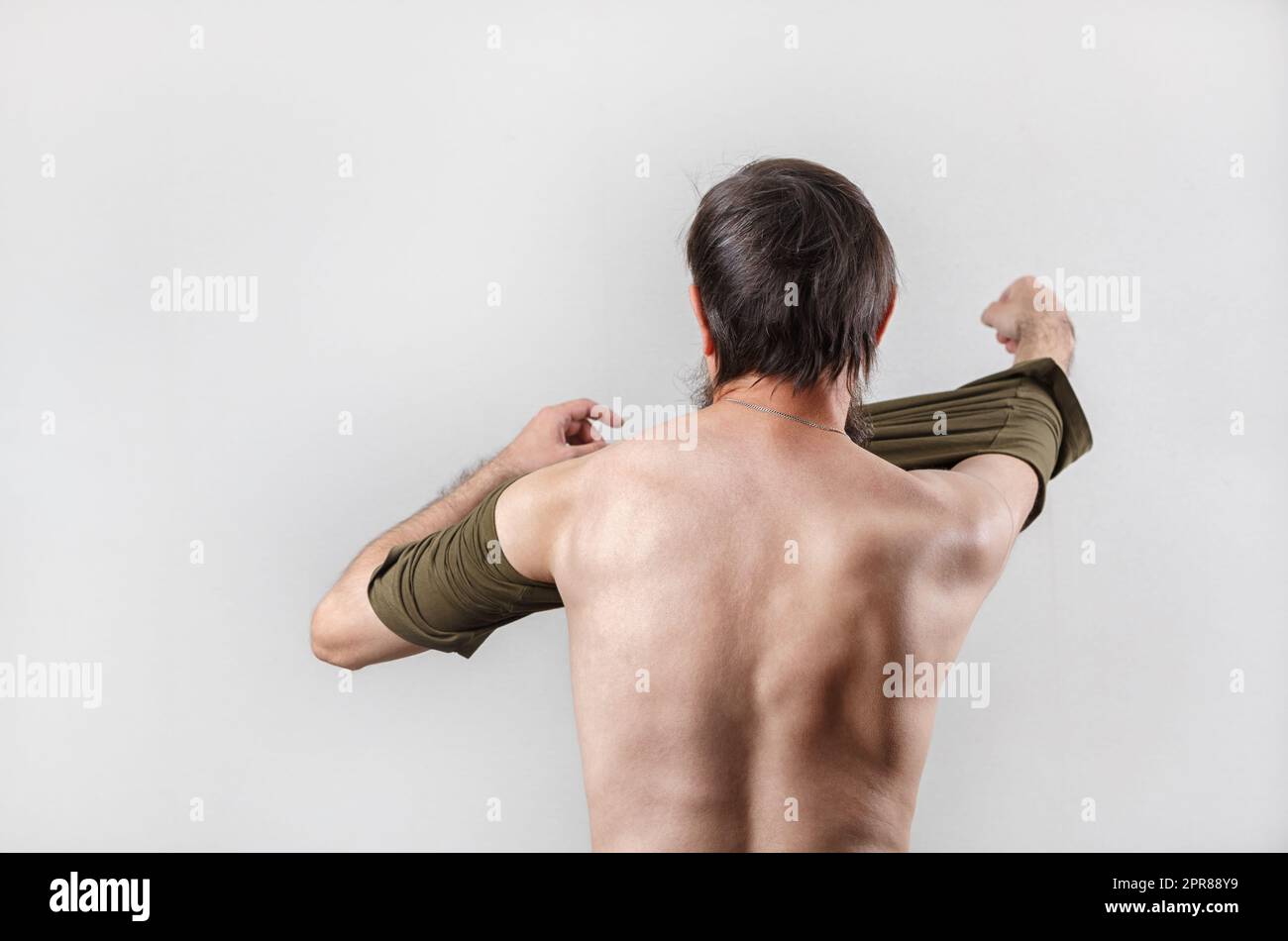 Man changing clothes Stock Photo - Alamy