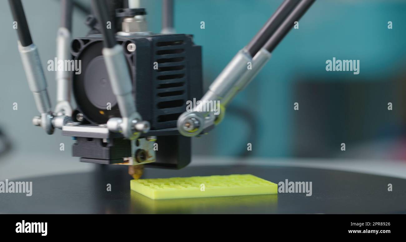 3D Printing Machine printing a piece of plastic Stock Photo - Alamy