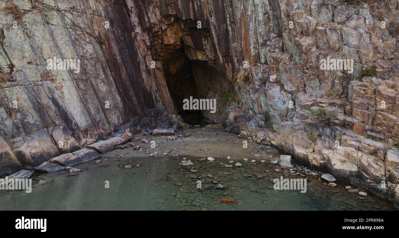 Sea cave with koi fish in Hong Kong Geopark Stock Photo - Alamy