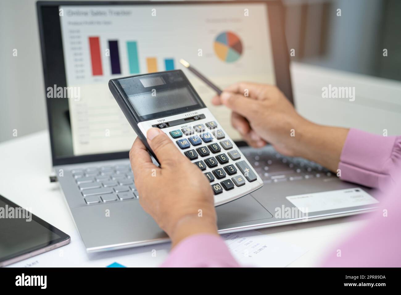 Asian accountant working and analyzing financial reports project ...