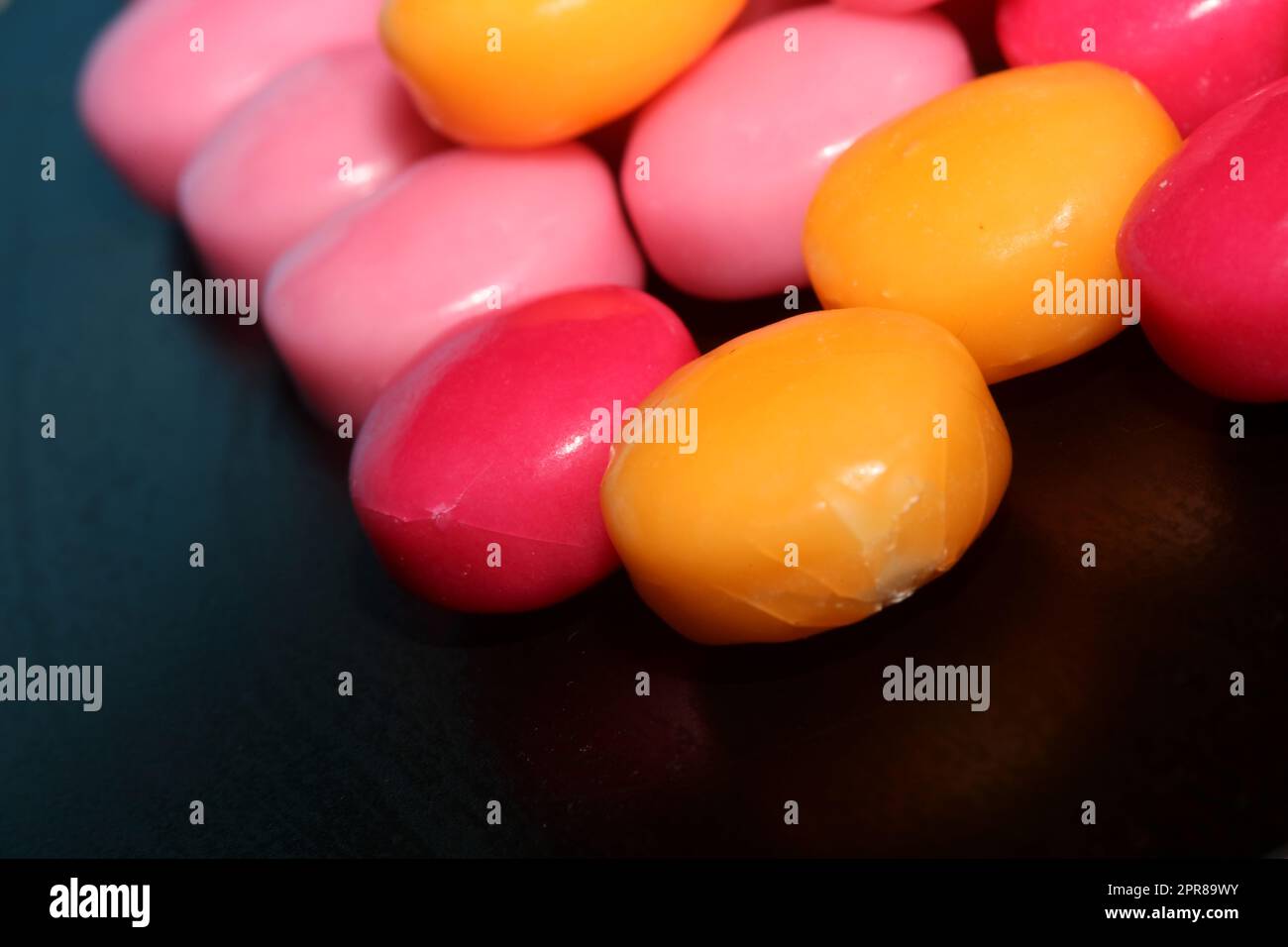 Colorful round sweet kinder bubble gums close up modern background big ...