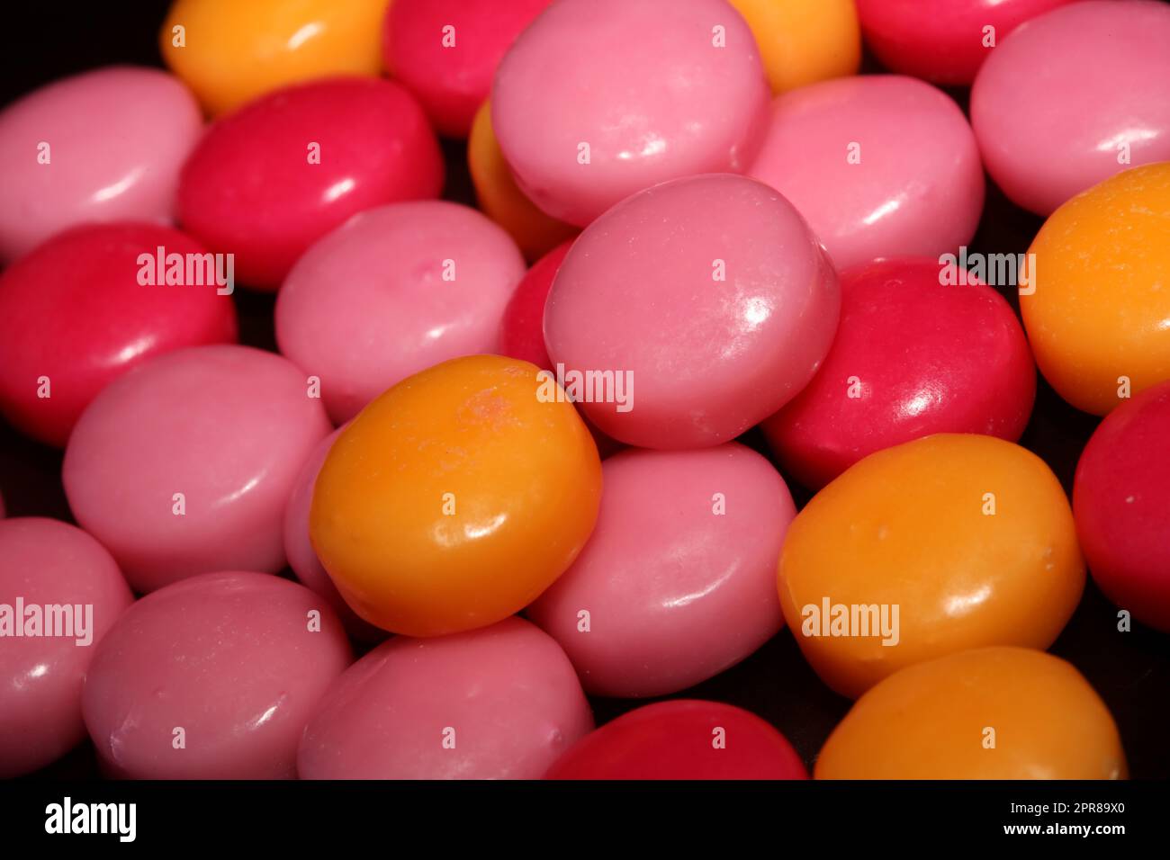 Colorful round sweet kinder bubble gums close up modern background big ...