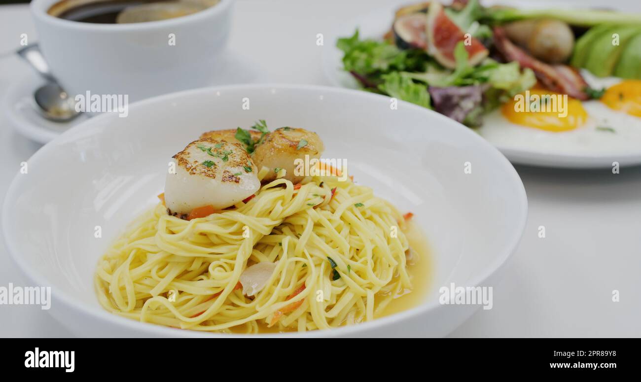 Fresh scallop pasta in coffee shop Stock Photo - Alamy