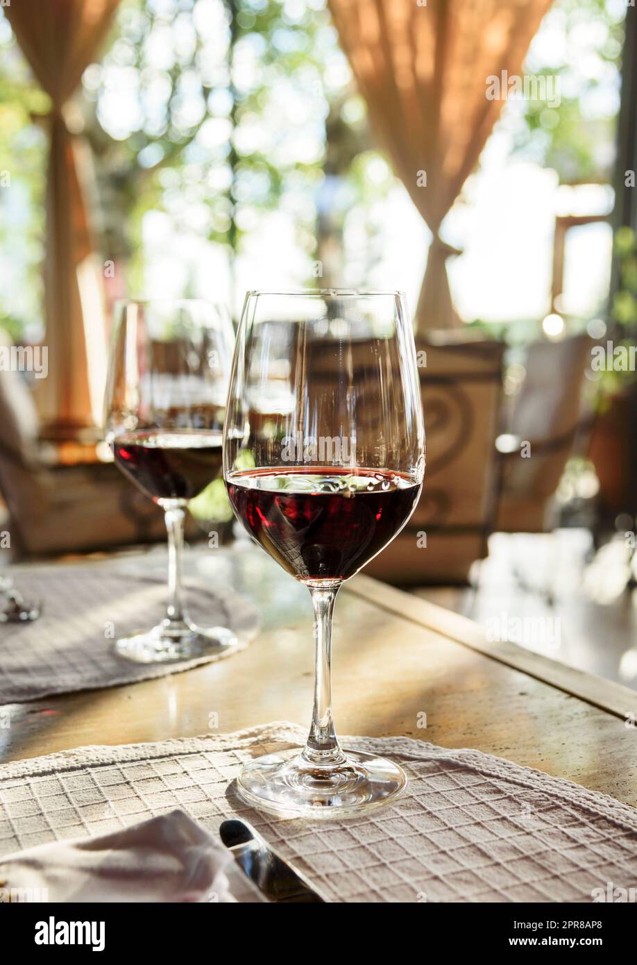 Restaurant table with wine glasses Stock Photo - Alamy