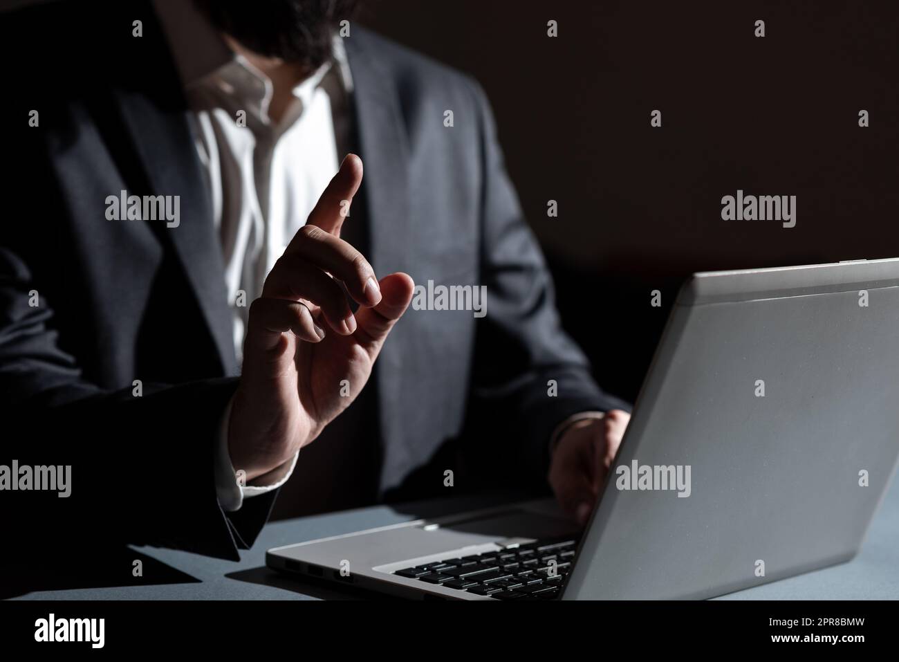 Businessman Typing Important Informations Into Lap Top And Pointing New ...