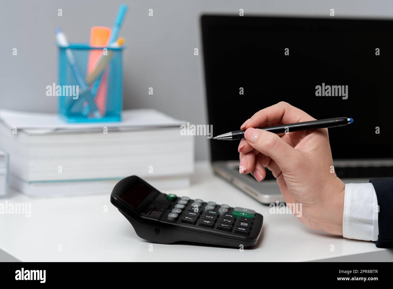 Businesswoman Pointing With Pen On Important Messages On Desk With ...