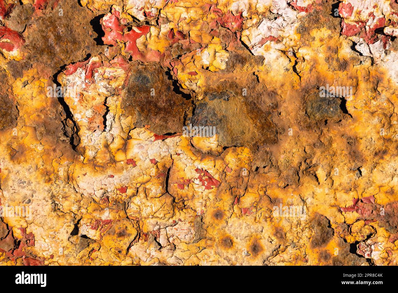Corrosion and deep crack on the texture of the surface. Peeling paint ...
