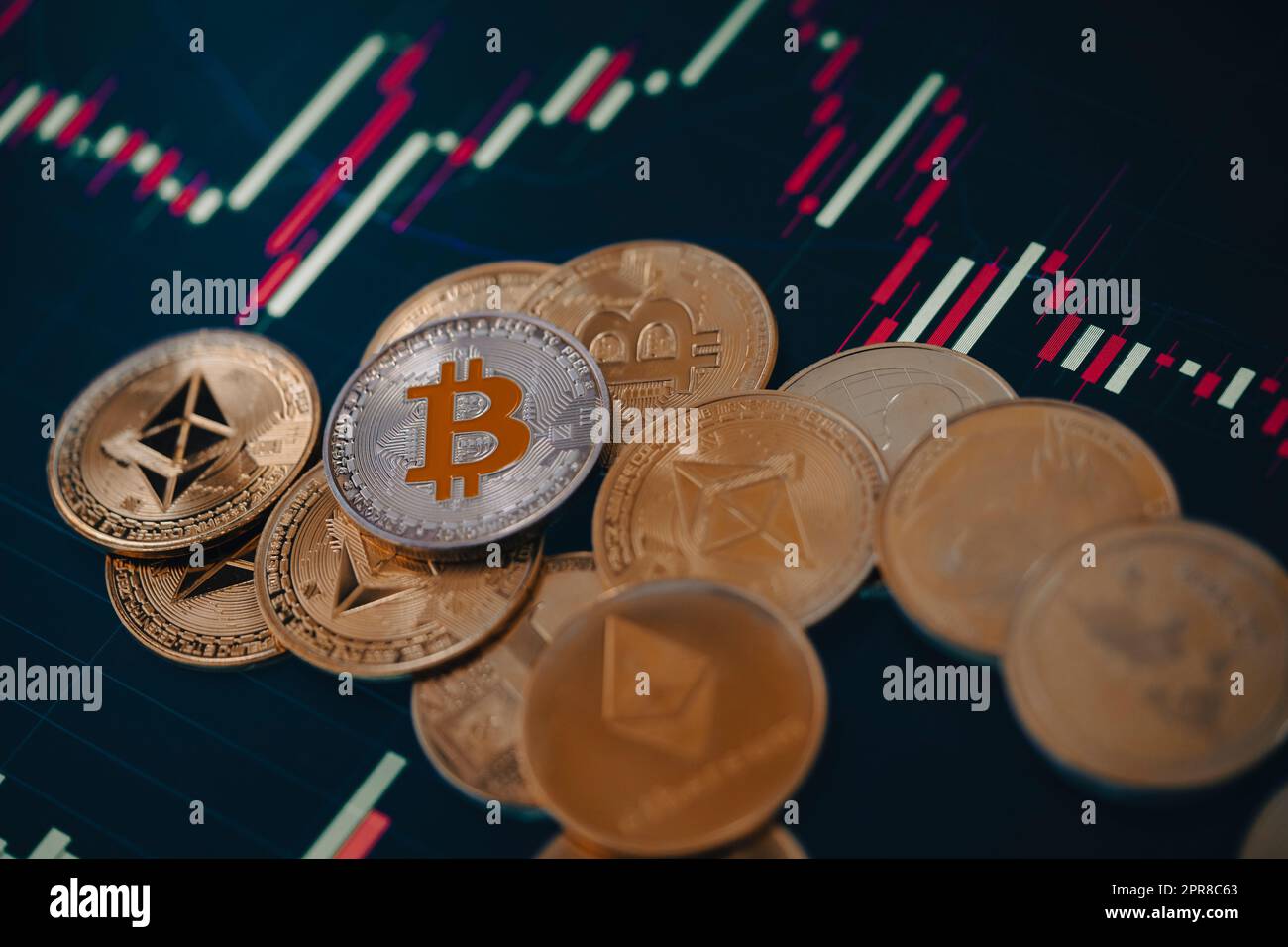Various Cryptocurrency coins with candle stick graph chart and digital ...