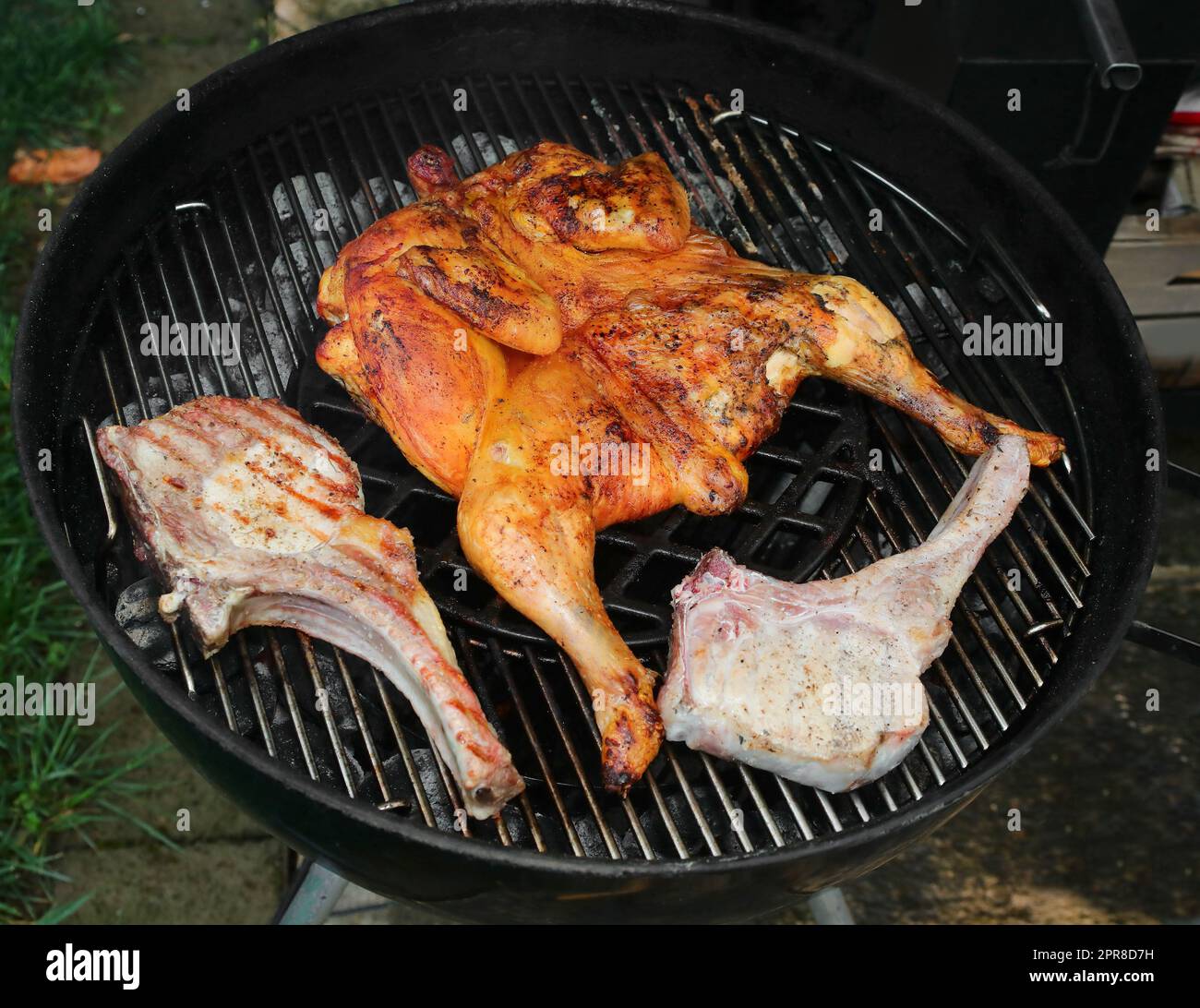 very big grilled chicken and bbq pork chop Stock Photo - Alamy