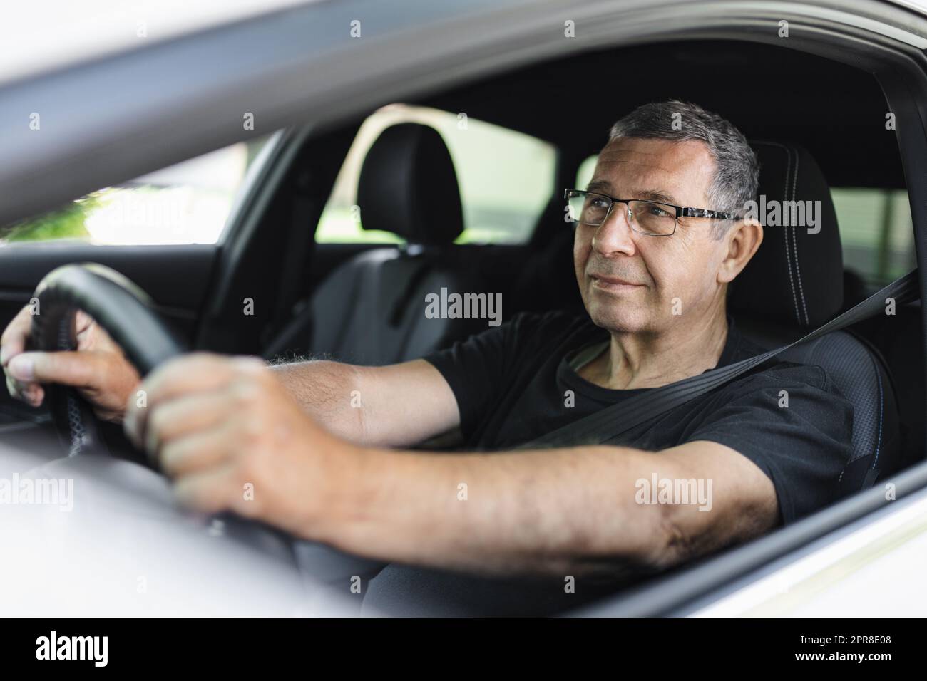 Senior in his 70s driving a car Stock Photo - Alamy