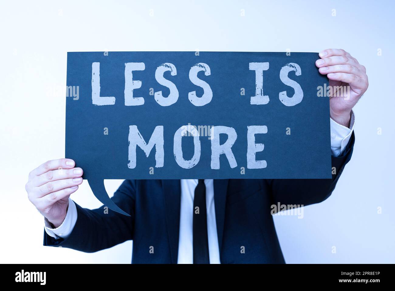 Hand writing sign Less Is More. Word Written on Minimalist approach to ...