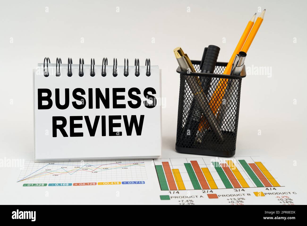 Business concept. On the table are business charts, office supplies and ...